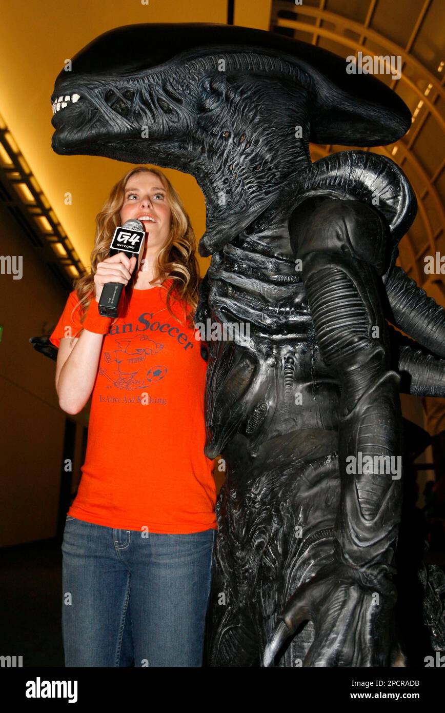 Blair Butler of G4 TV, left, interviews Mike Moore, dressed in a ...