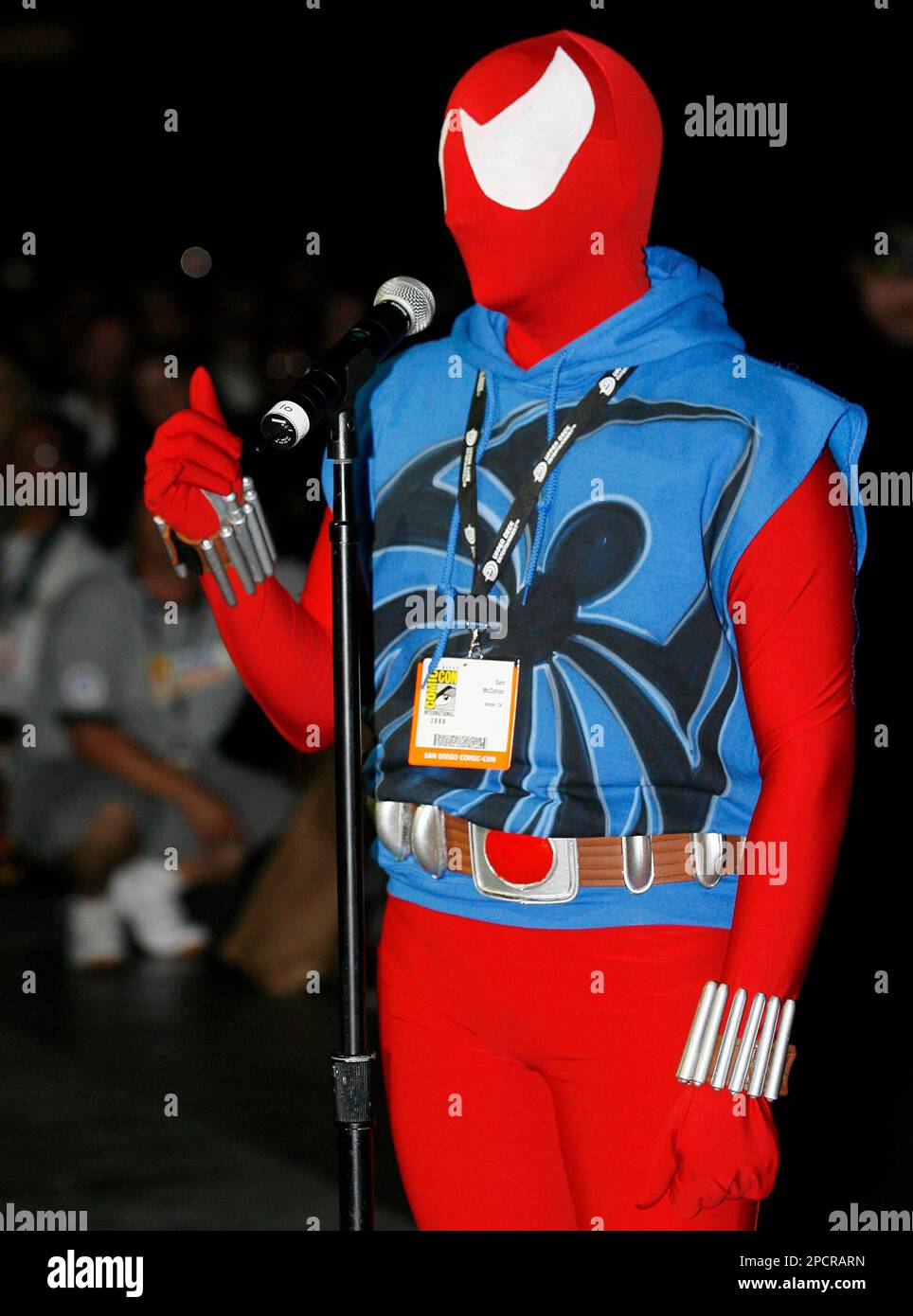 Sam McClellan, dressed as Spider-Man, asks a question during a ...