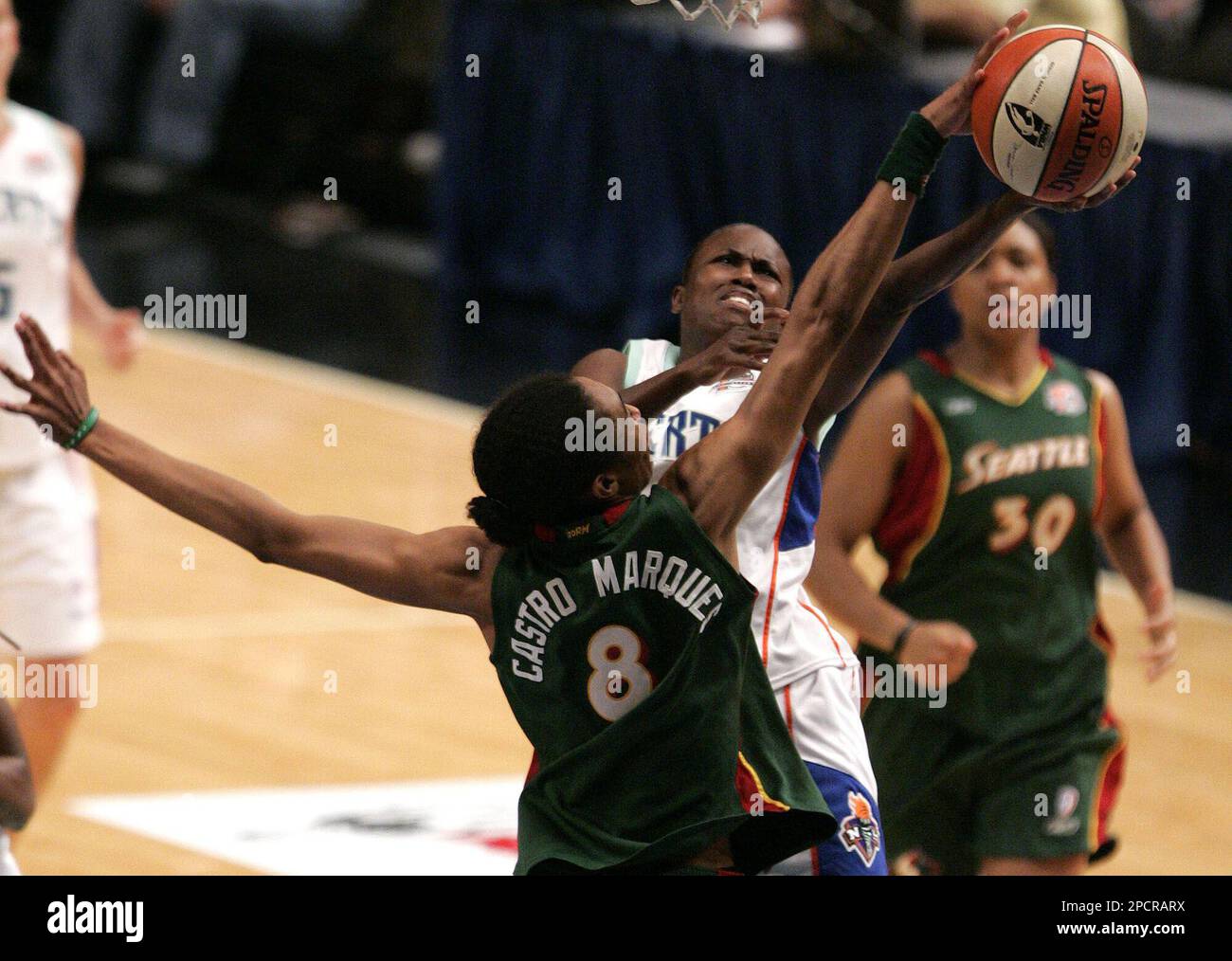 New York Liberty's Sherill Baker, right, goes up for a shot against ...