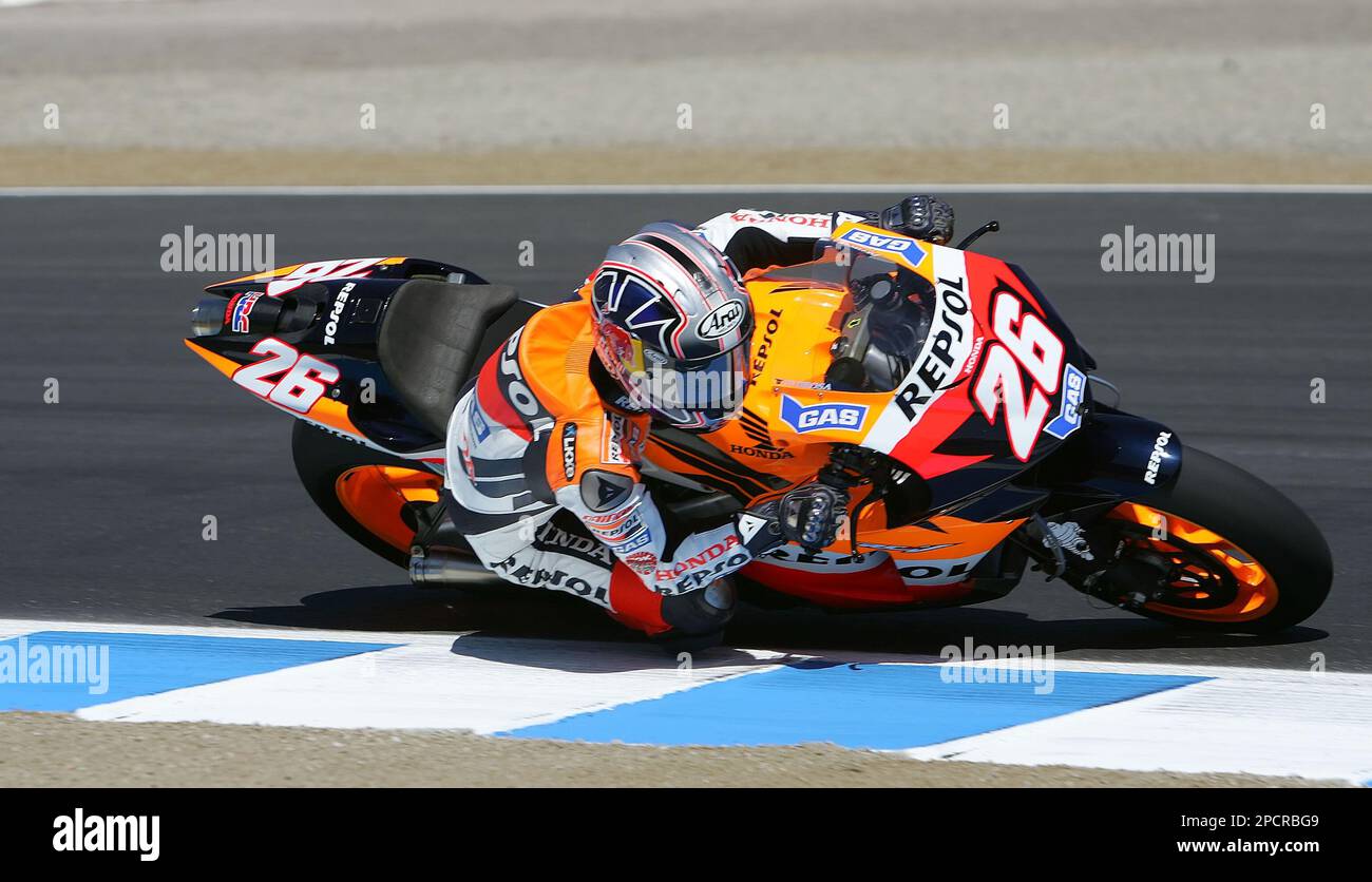 Nicky Hayden, of the United States, makes a sharp turn during a pratice ...