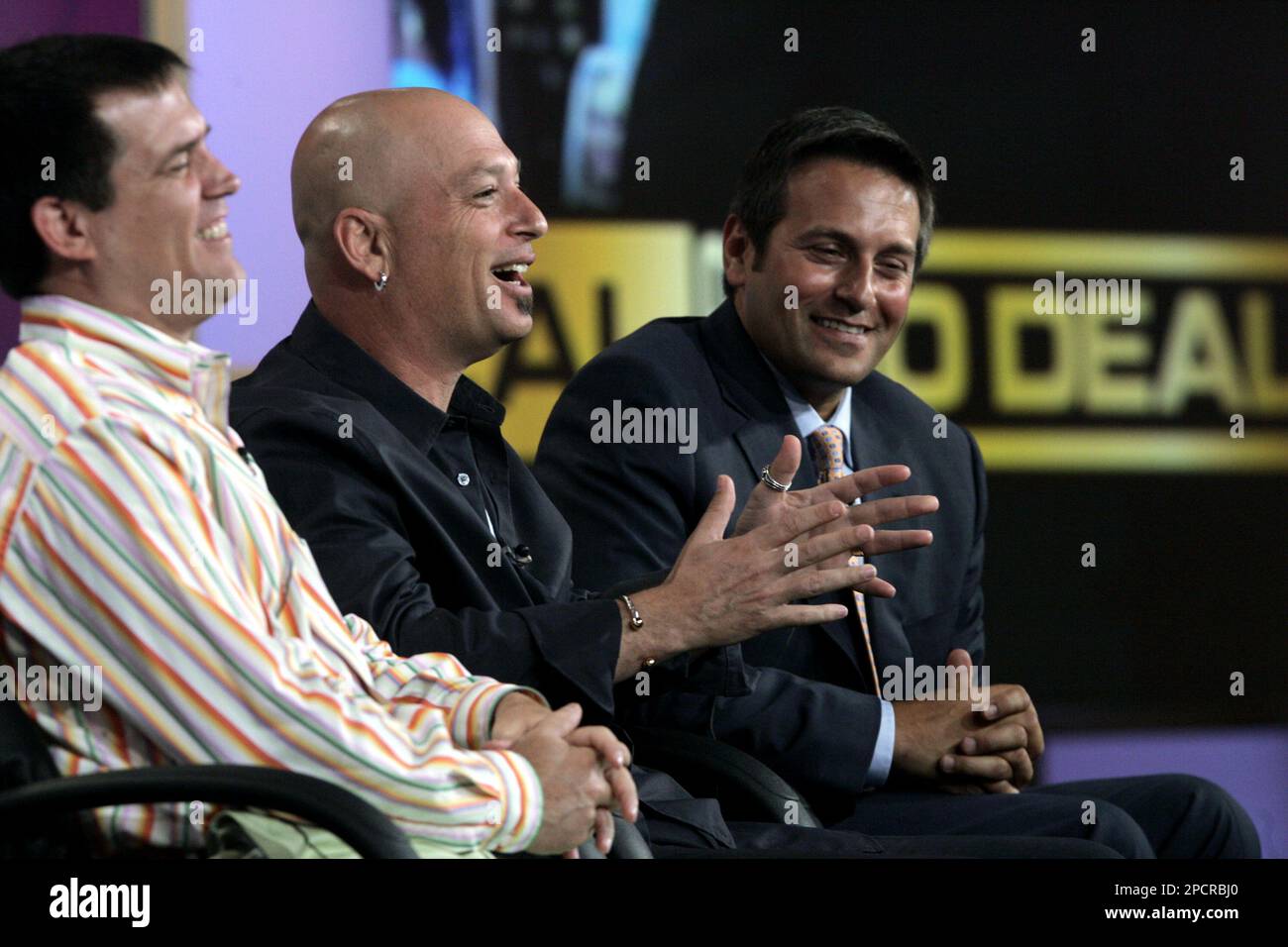 Executive producer Scott St. John, left, host Howie Mandel, center, and ...