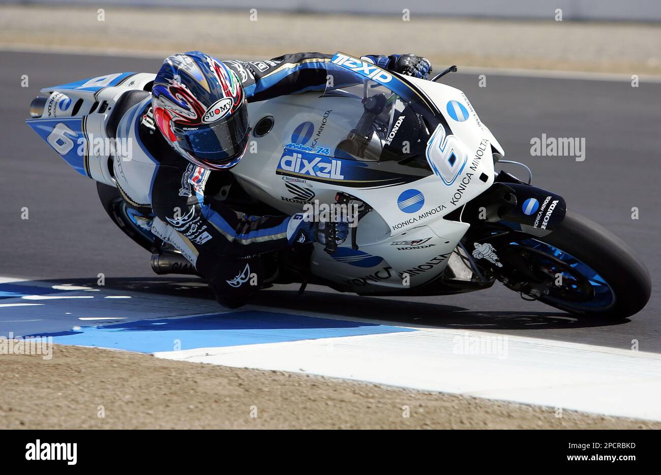 Makoto Tamada, of Japan, makes a sharp tun during a practice run of the ...