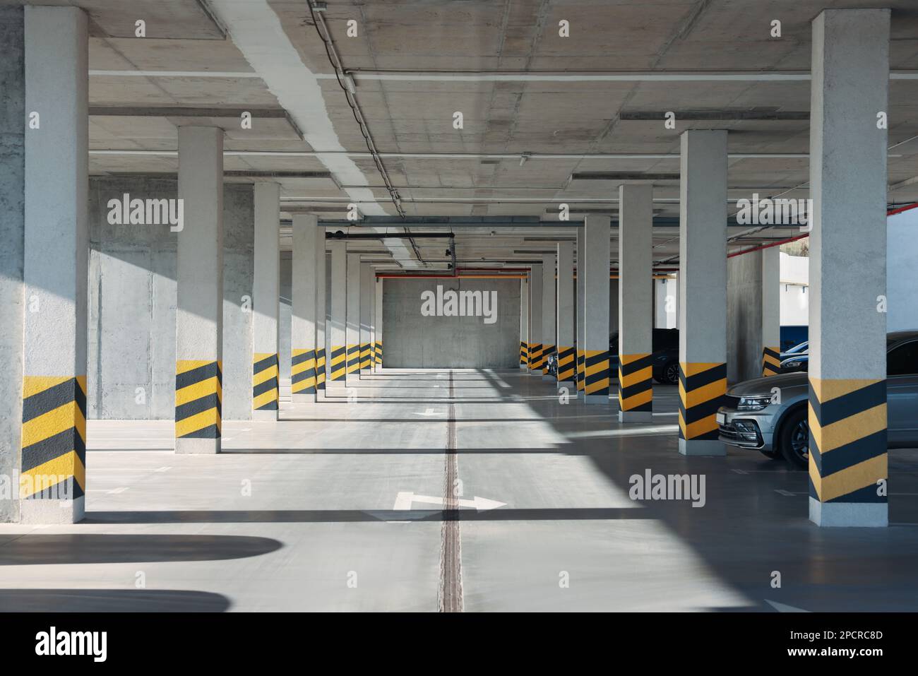 Open parking garage with cars on sunny day Stock Photo - Alamy