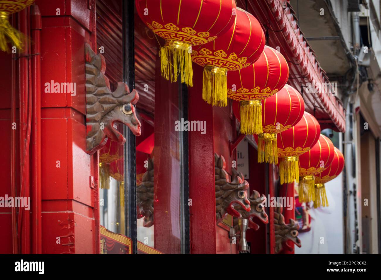 Golden lanterns hanging on red hi-res stock photography and images - Alamy