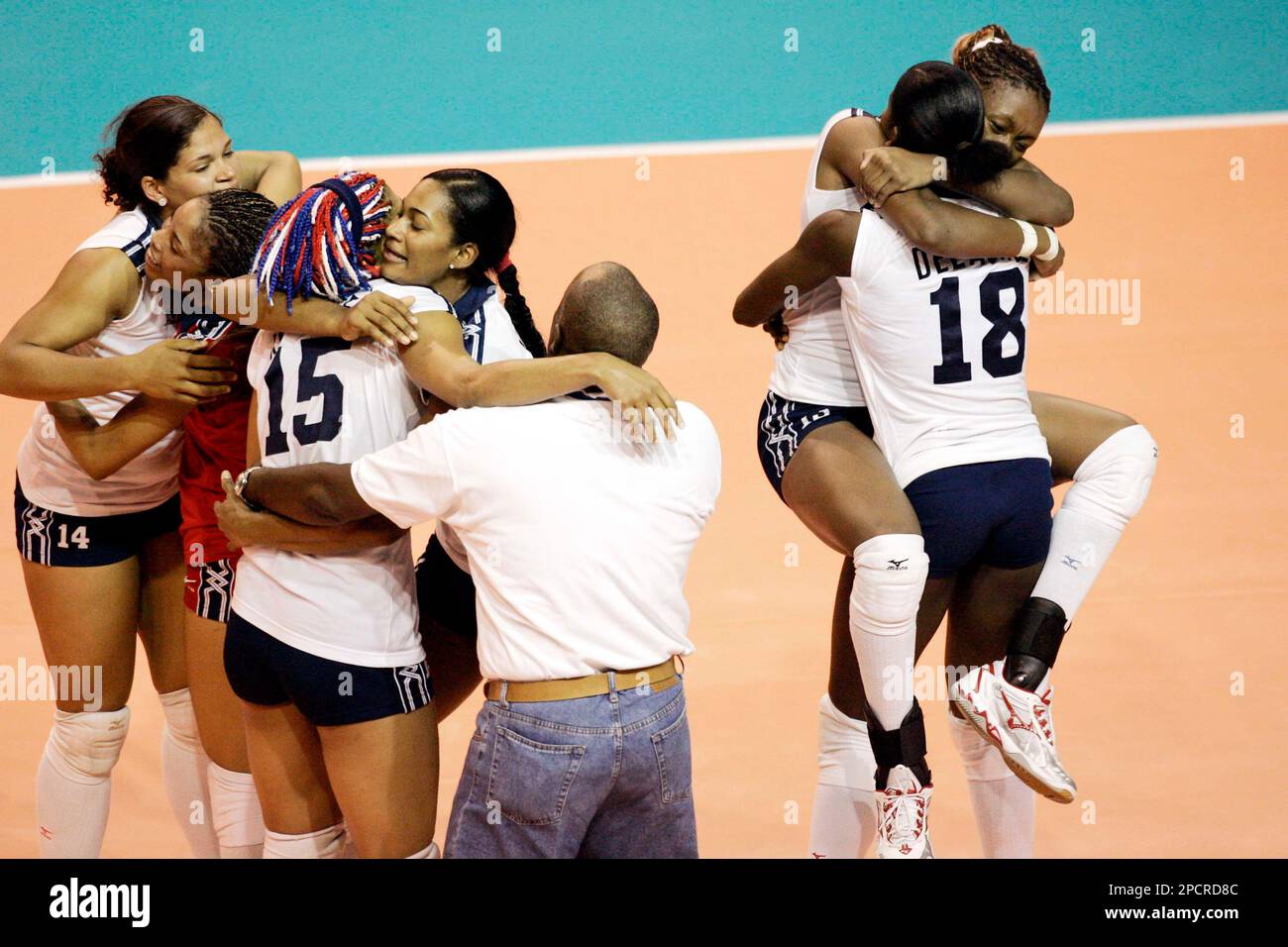 Members of the Dominican Republic volleyball team react after beating ...