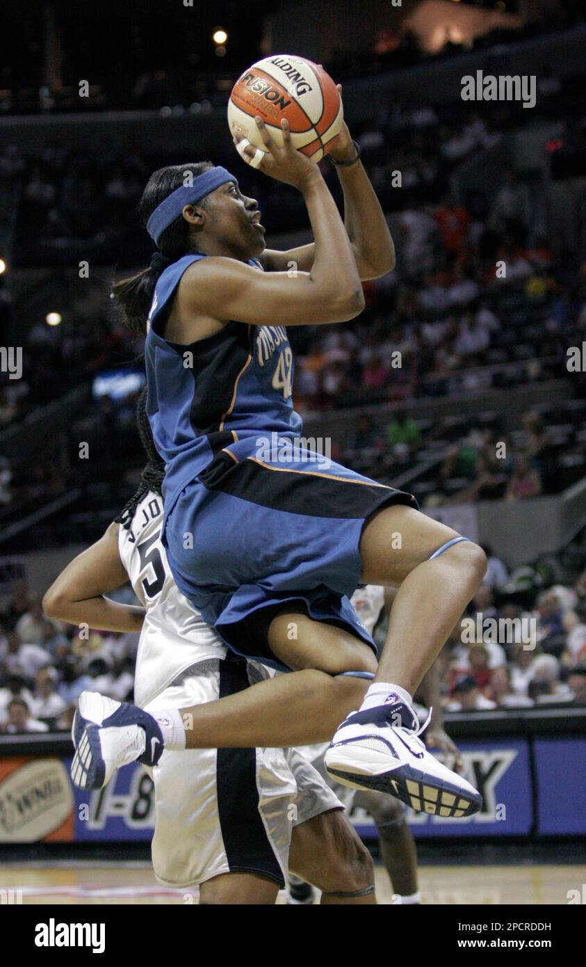 Washington Mystics' Nikki Teasley (42) goes around San Antonio Silver ...