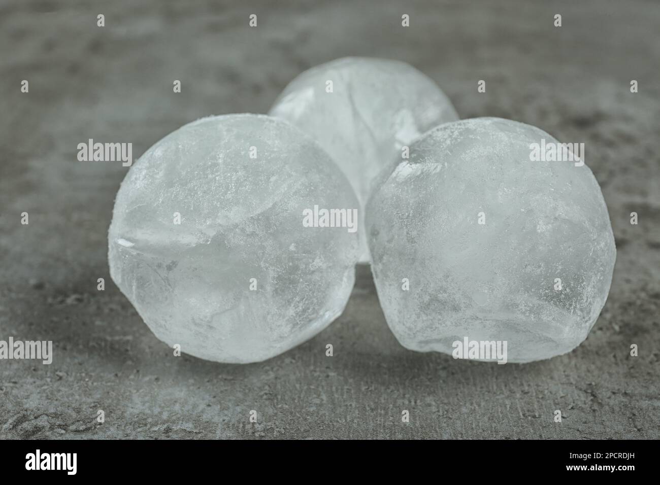 Frozen ice balls on grey table, closeup Stock Photo - Alamy