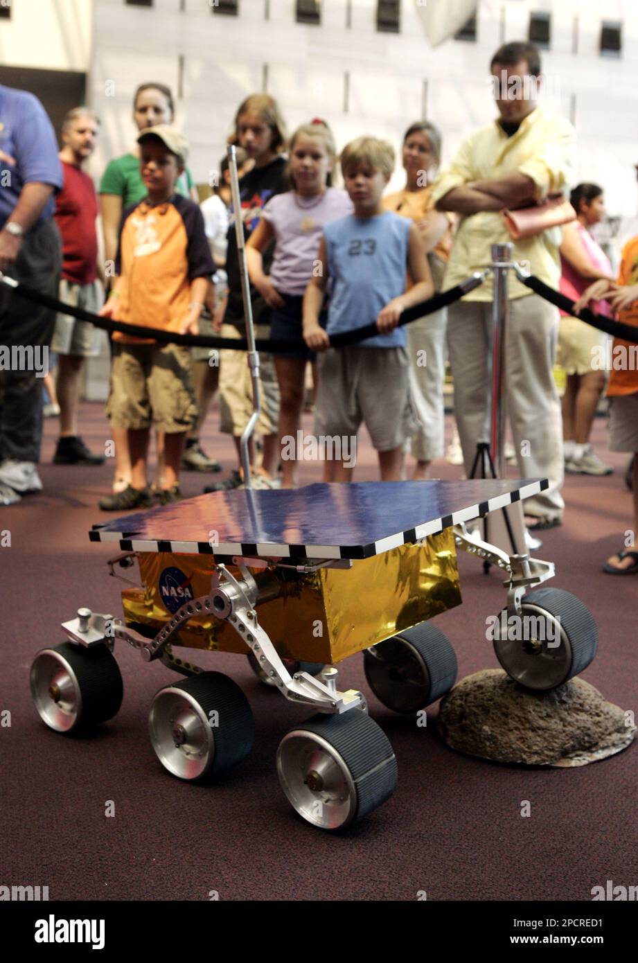 Visitors to the Smithsonian's National Air and Space Museum look at a ...