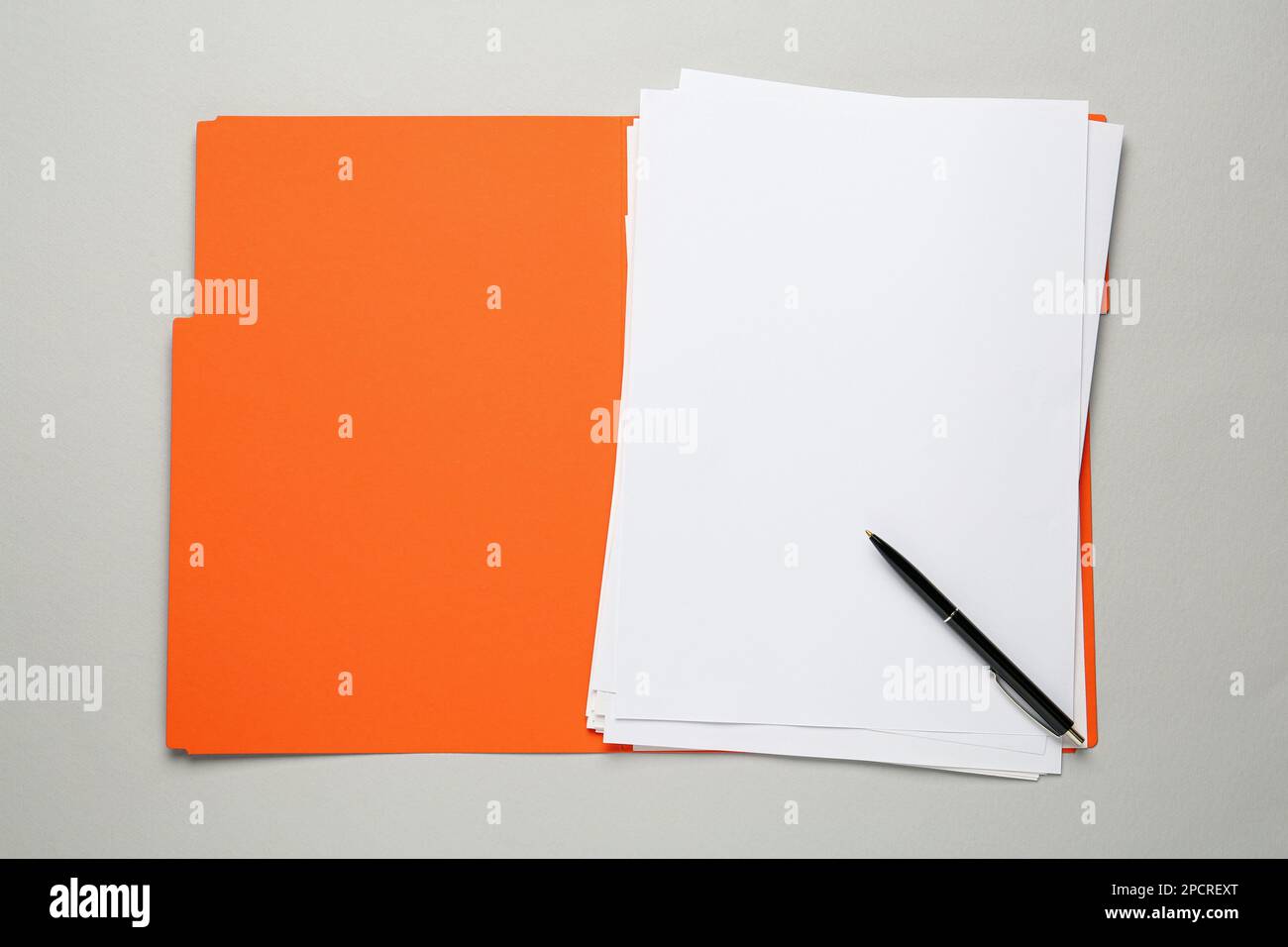 Orange file with blank sheets of paper and pen on light grey background ...