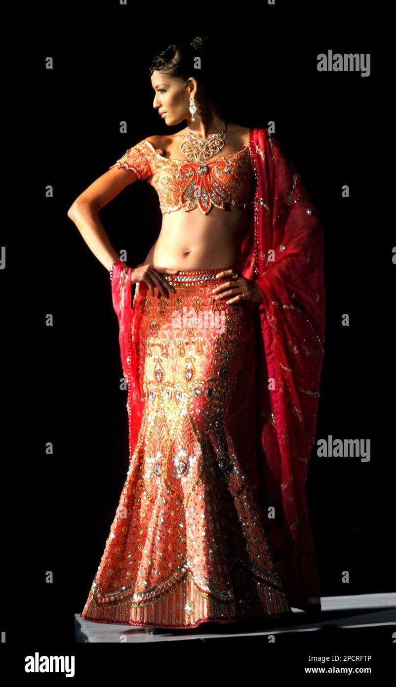An Indian model showcases a design by India and Pakistani designers at ...