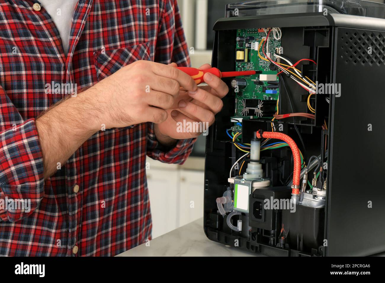 Man fixing coffee machine hi-res stock photography and images - Alamy