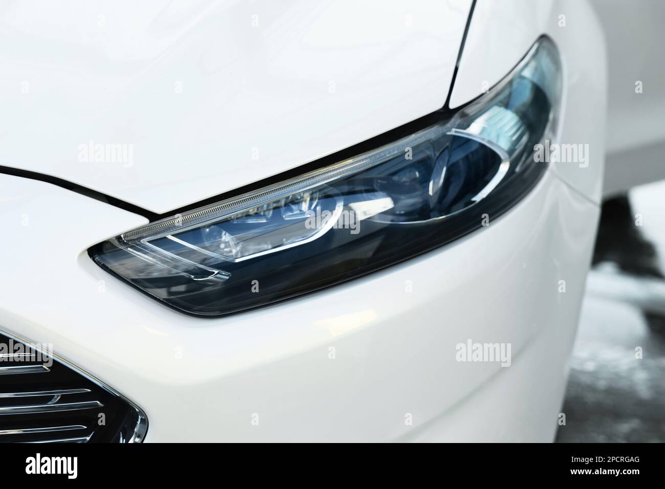 Luxury white car outdoors, closeup of headlight Stock Photo - Alamy