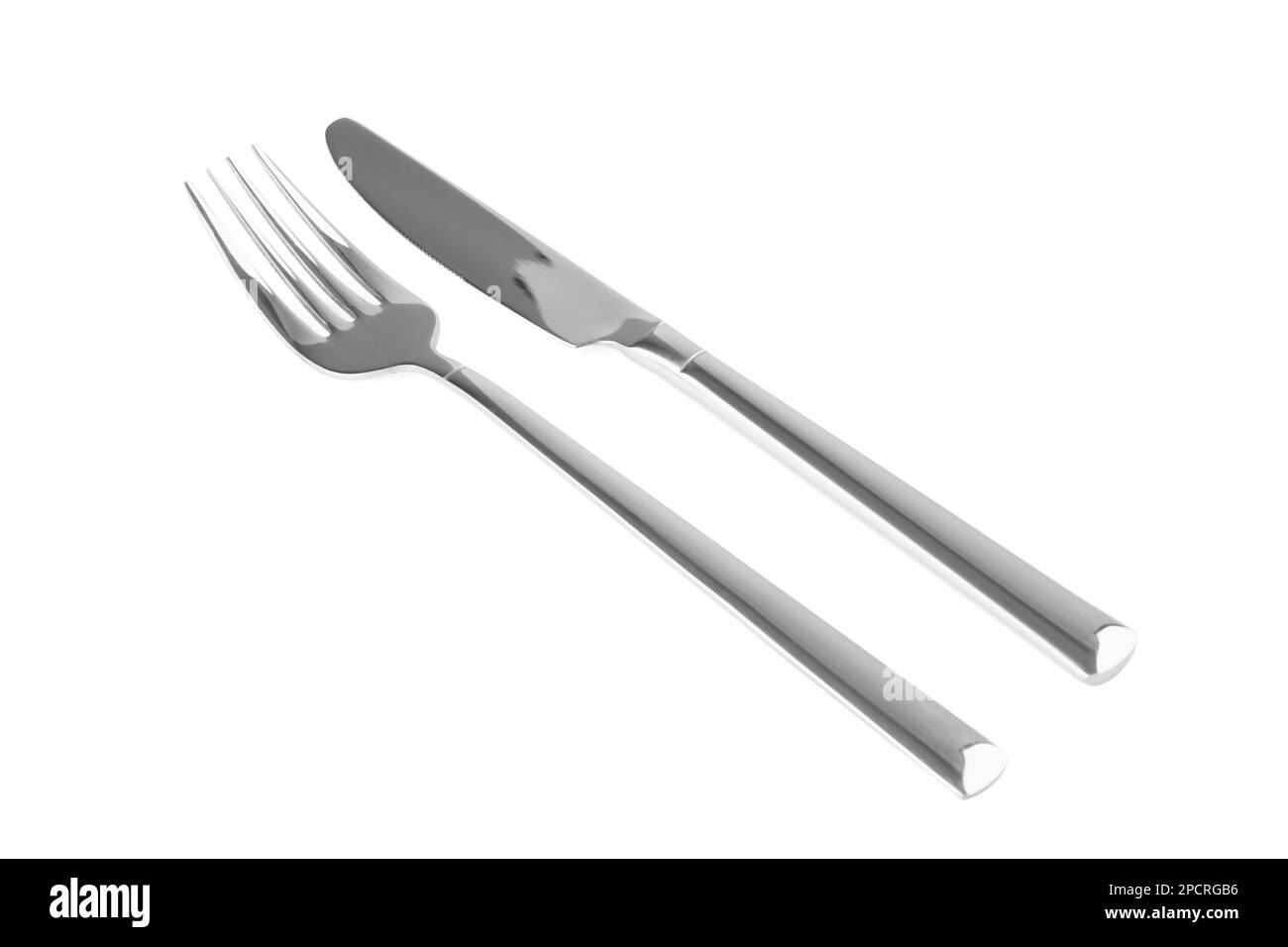 New shiny fork and knife on white background Stock Photo - Alamy