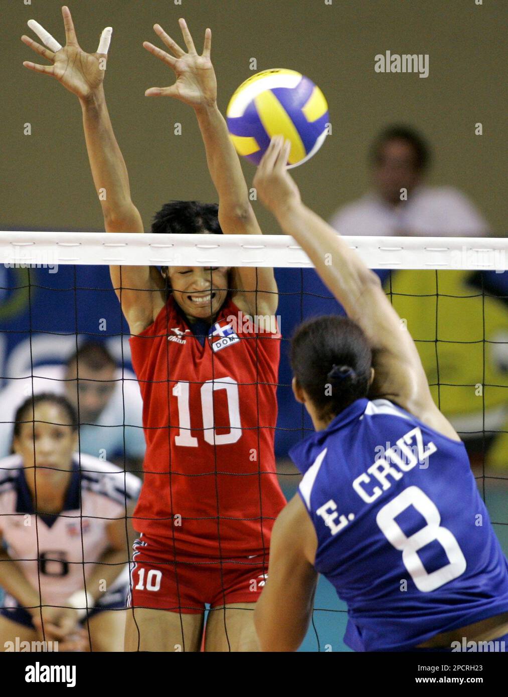 Eva Cruz, right, spikes the ball against Milagros Cabral, left, of ...