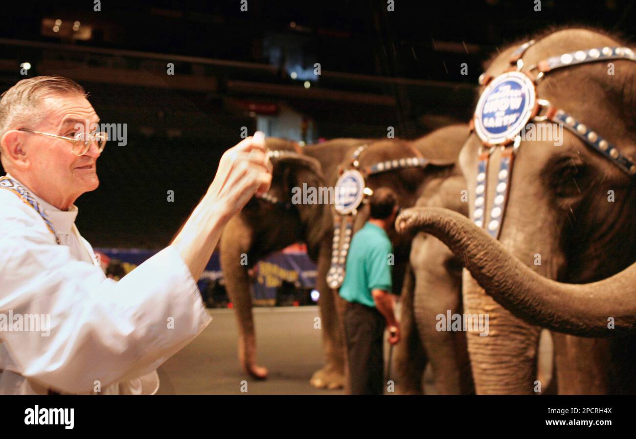 Father Leo Steinbock blesses an Asian elephant during a ceremony for ...
