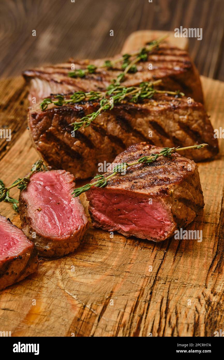 Closeup view of medium rare beef steak, prime strip loin meat Stock ...