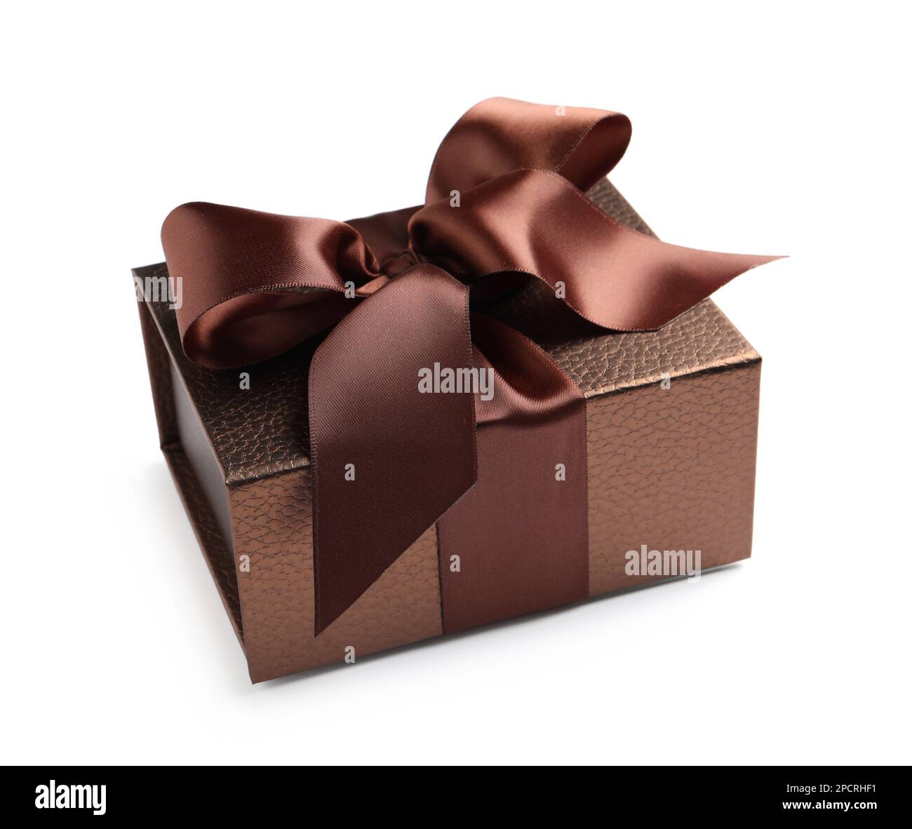 Brown gift box decorated with satin ribbon and bow on white background ...
