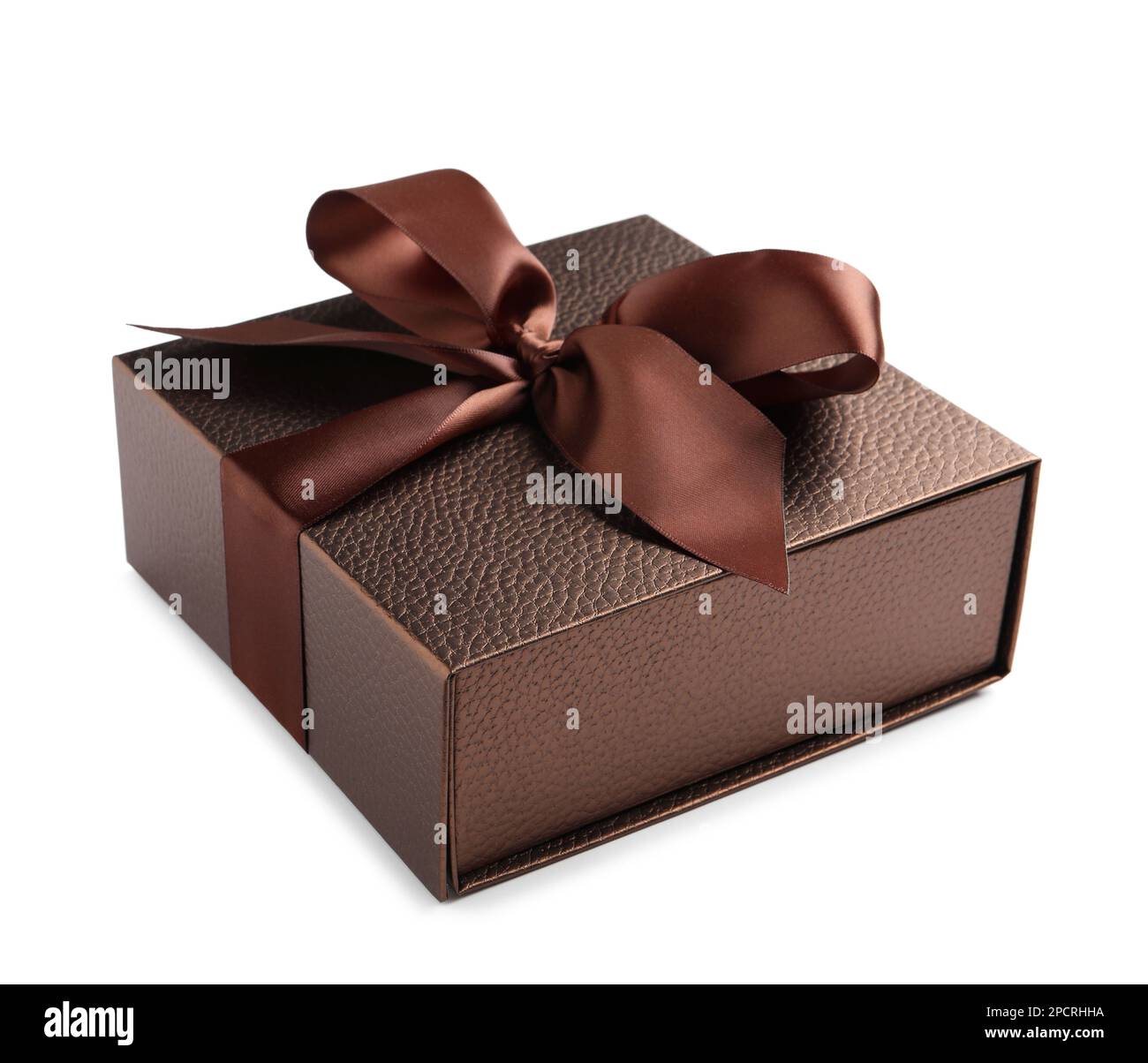 Brown gift box decorated with satin ribbon and bow on white background ...