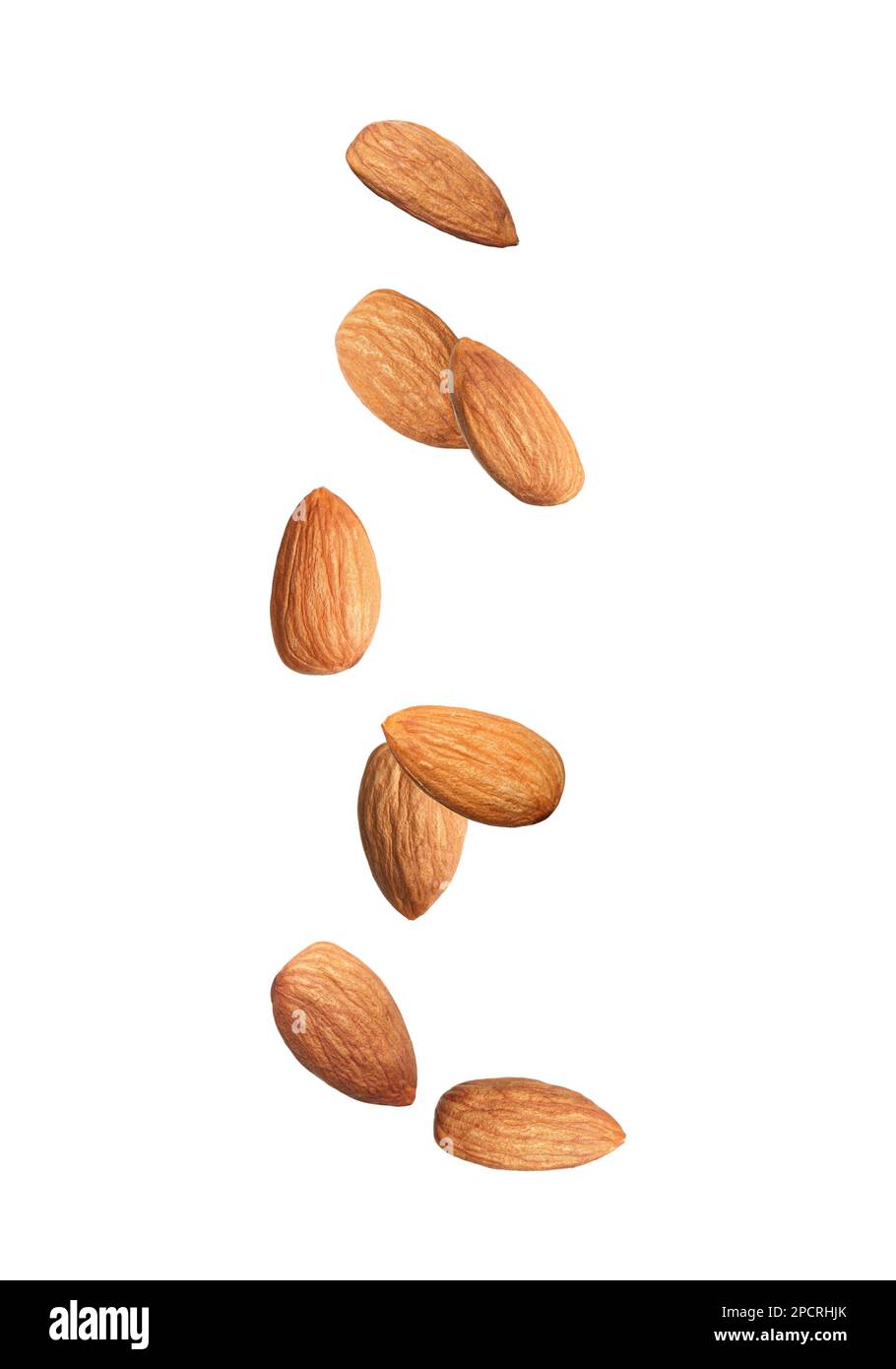 Many tasty almonds falling on white background Stock Photo - Alamy