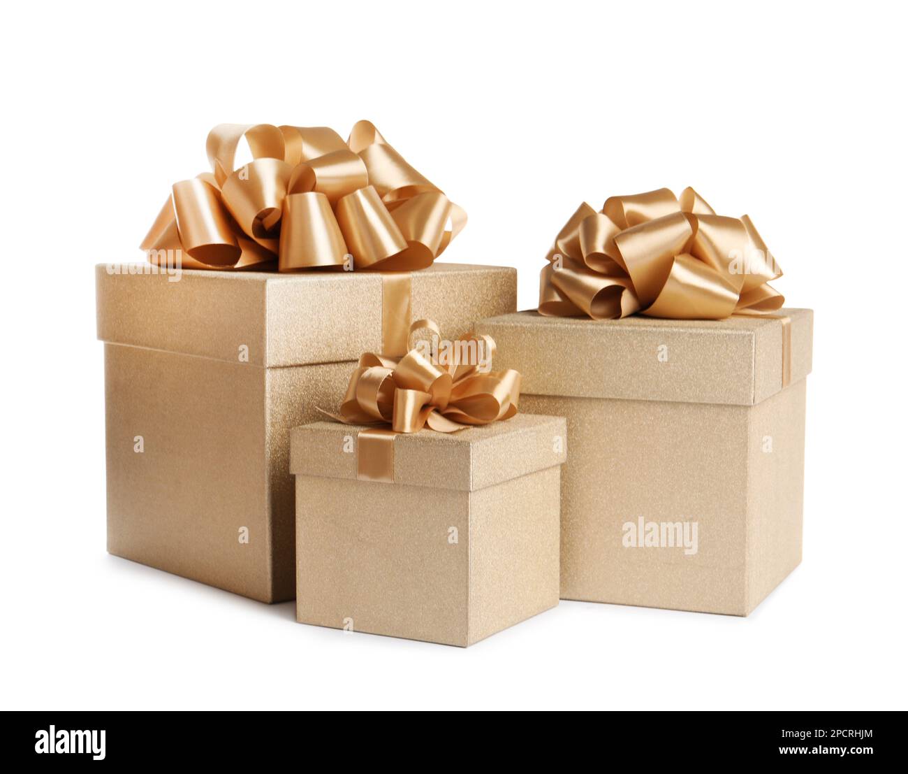 Golden gift boxes with satin bows on white background Stock Photo - Alamy