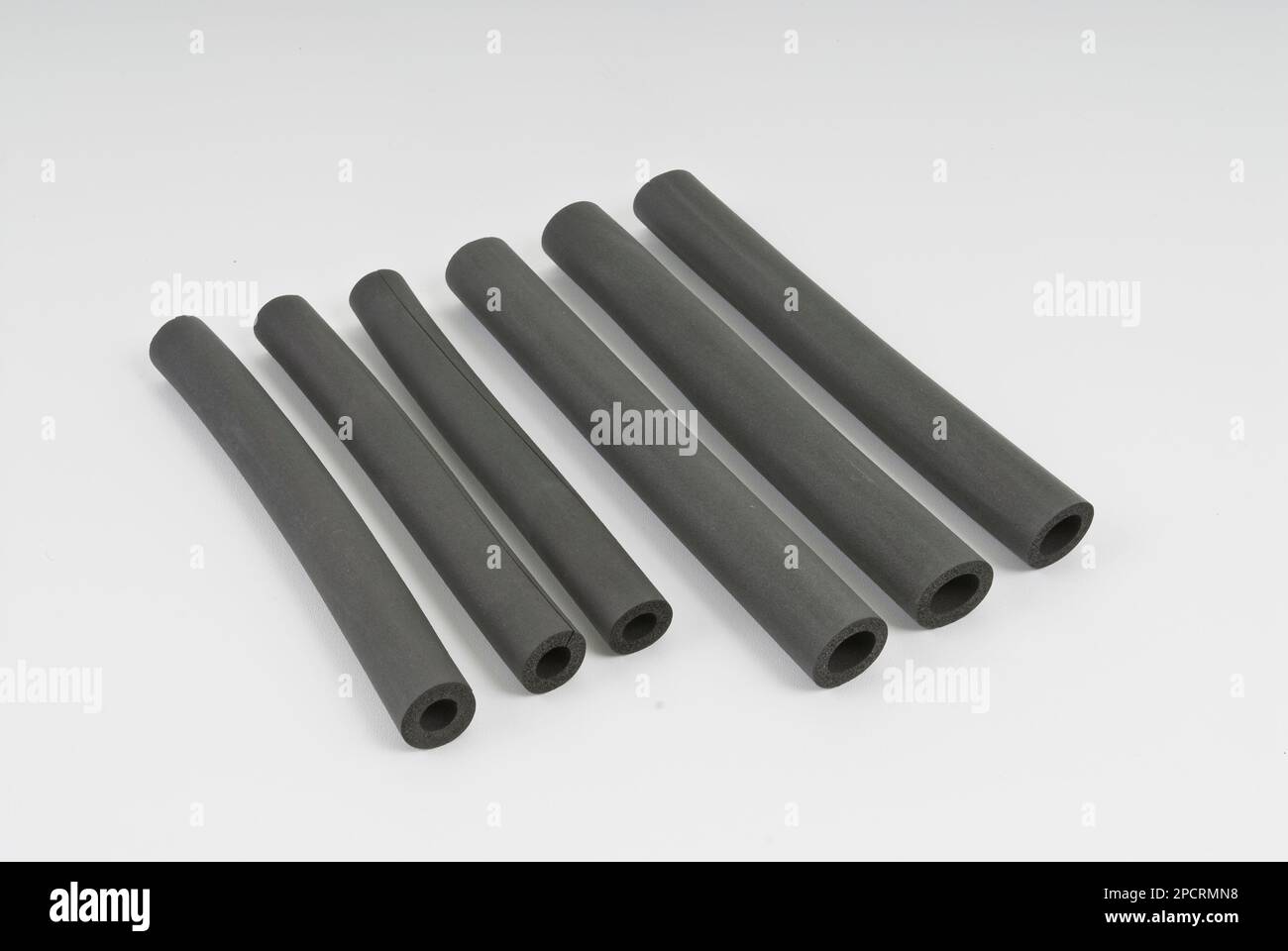 Roll of gray foam rubber sheet isolated in white. High quality photo ...
