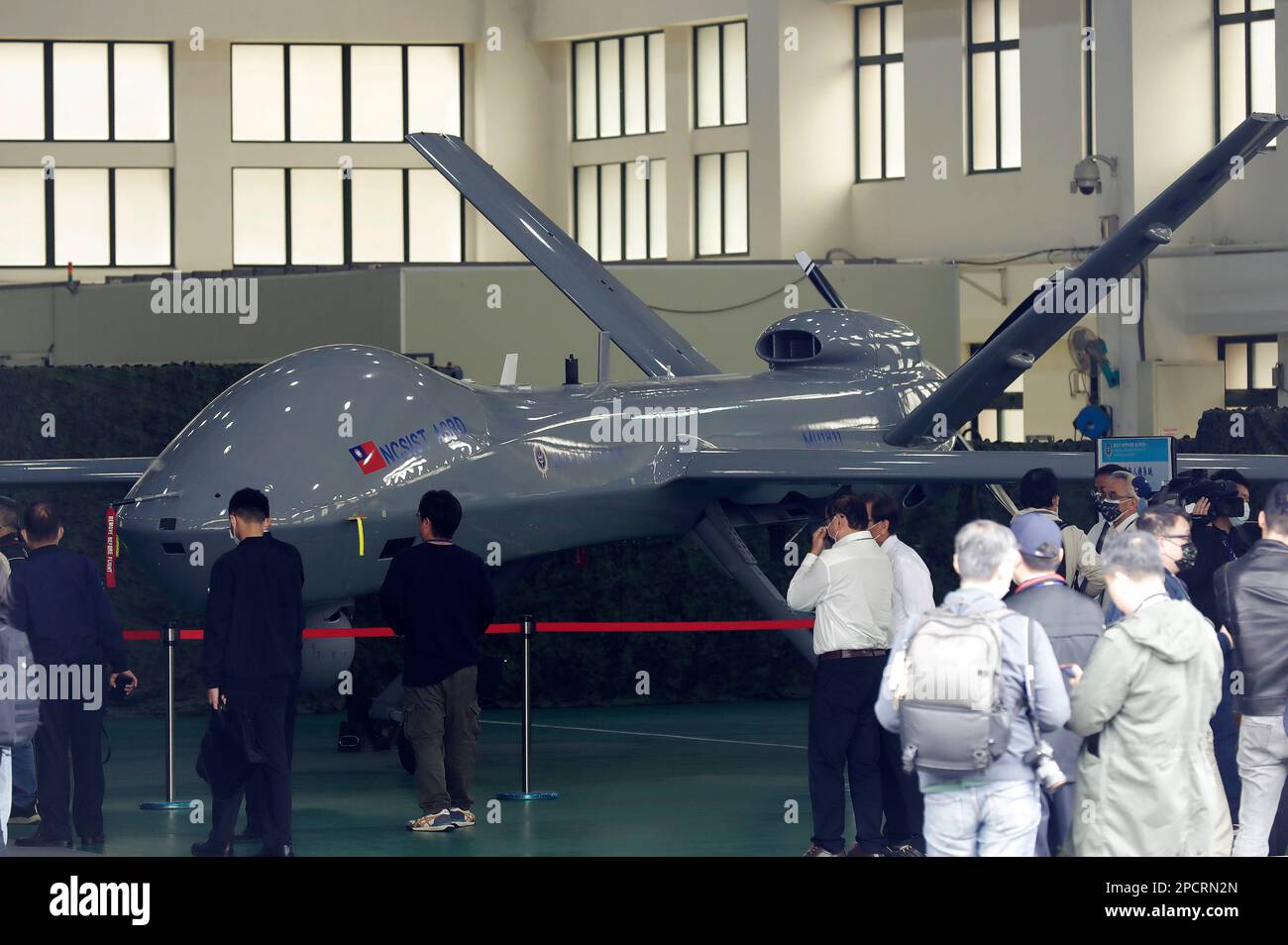 Visitors look at a Medium Altitude Long Endurance UAV drone at National ...