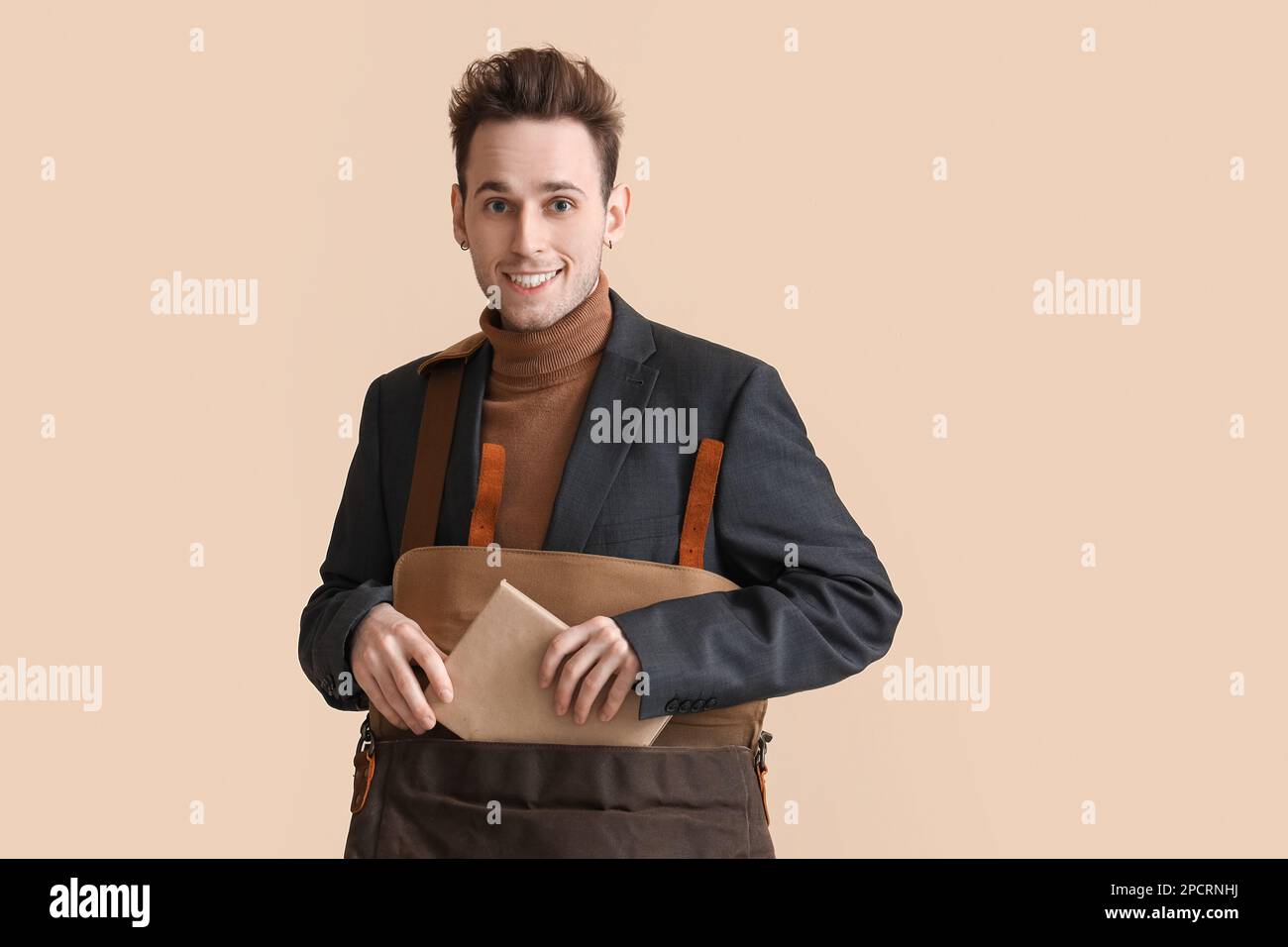 Man in library putting book hi-res stock photography and images - Alamy