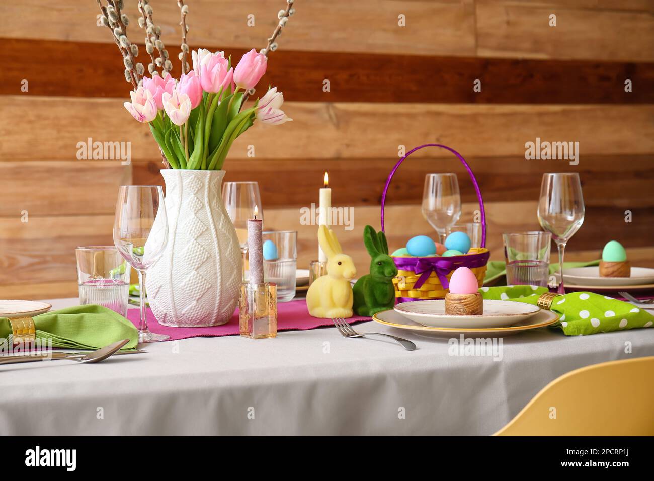 Beautiful Easter table setting with flowers and eggs in dining room ...