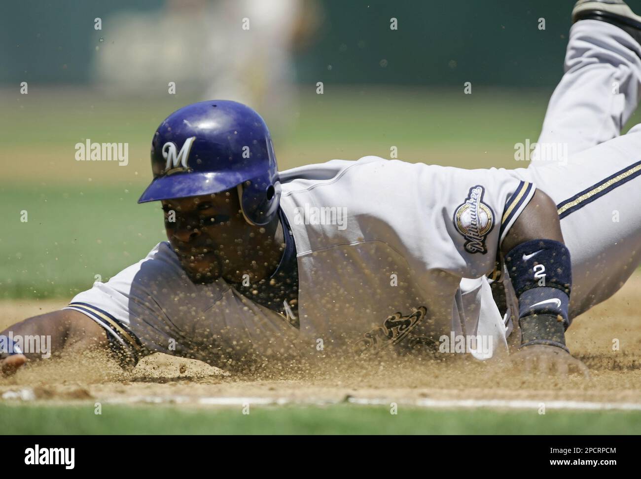 Milwaukee Brewers' Bill Hall goes sliding back to first base but is ...
