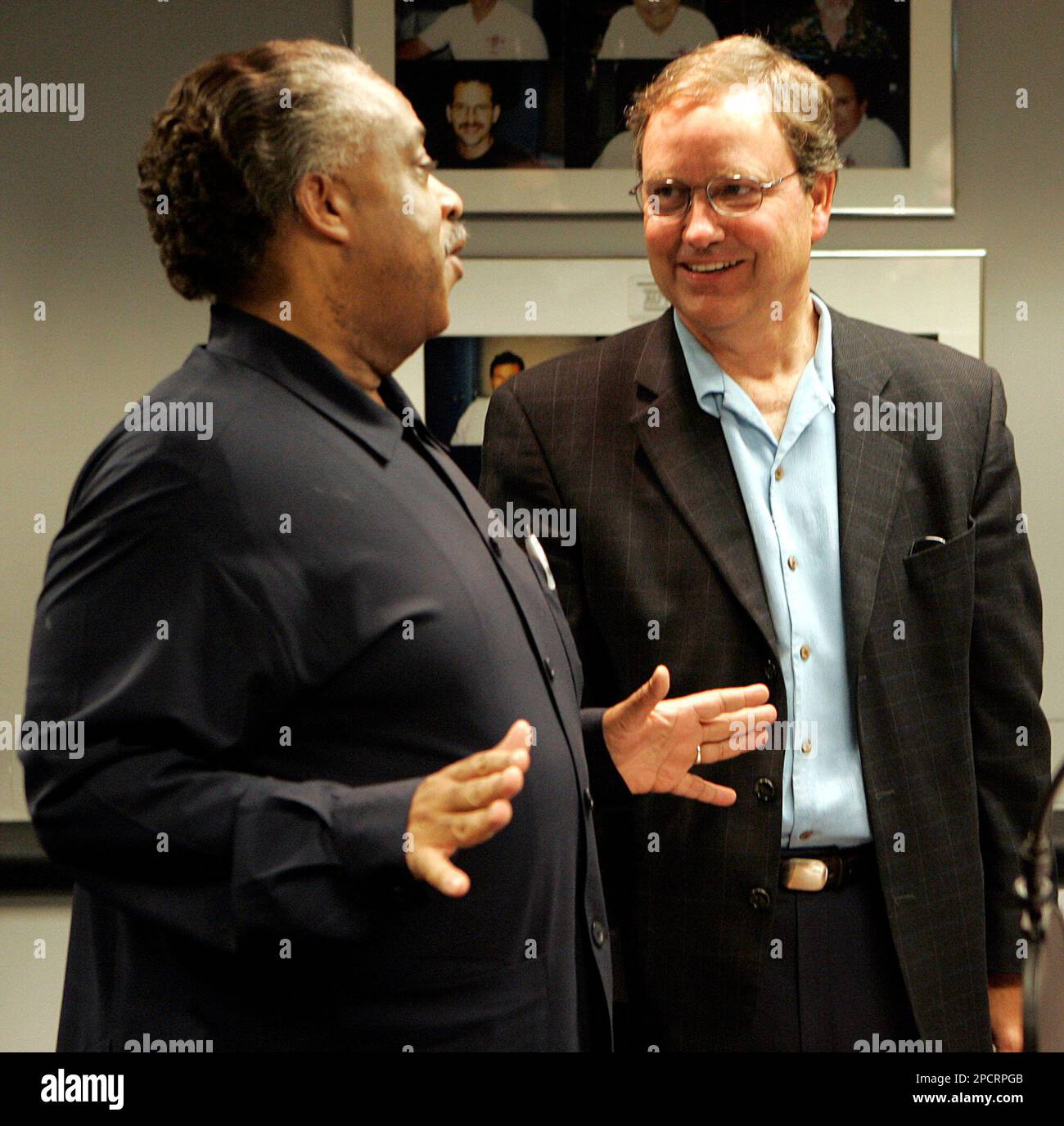 Wal mart CEO Lee Scott, right, speaks with Rev. Al Sharpton before a ...