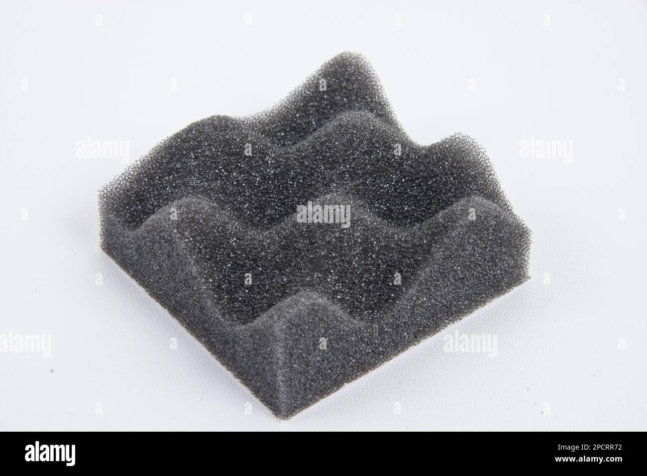 Roll of gray foam rubber sheet isolated in white. High quality photo ...