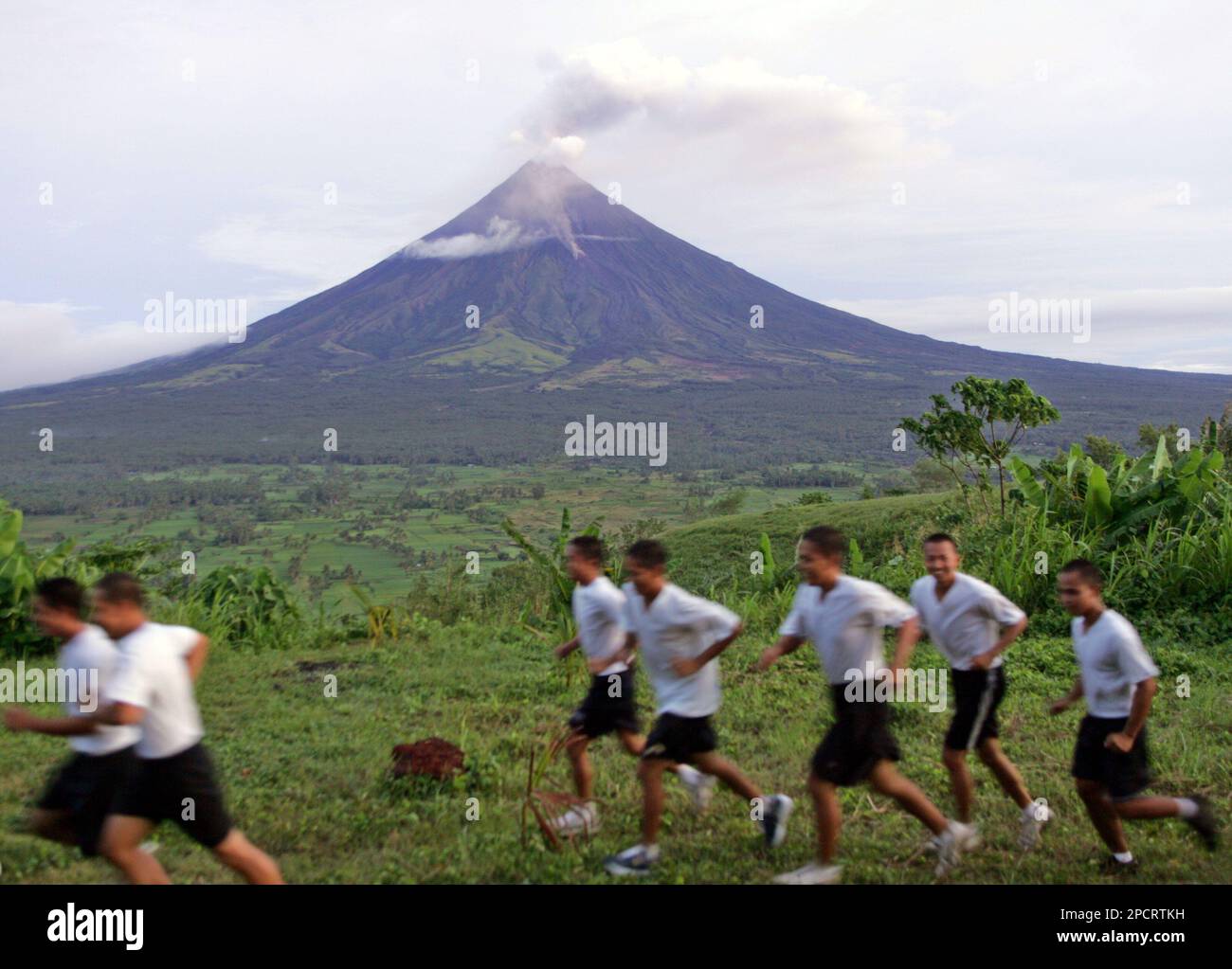 Philippine police trainees jog back to their camp after reaching the ...