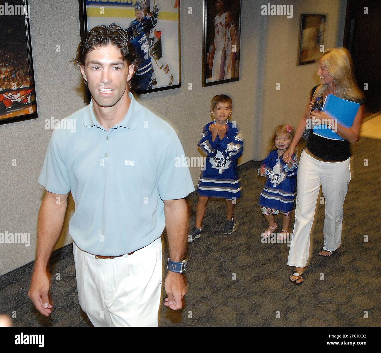 Michael Peca arrives at a news conference with his wife Kristen and ...