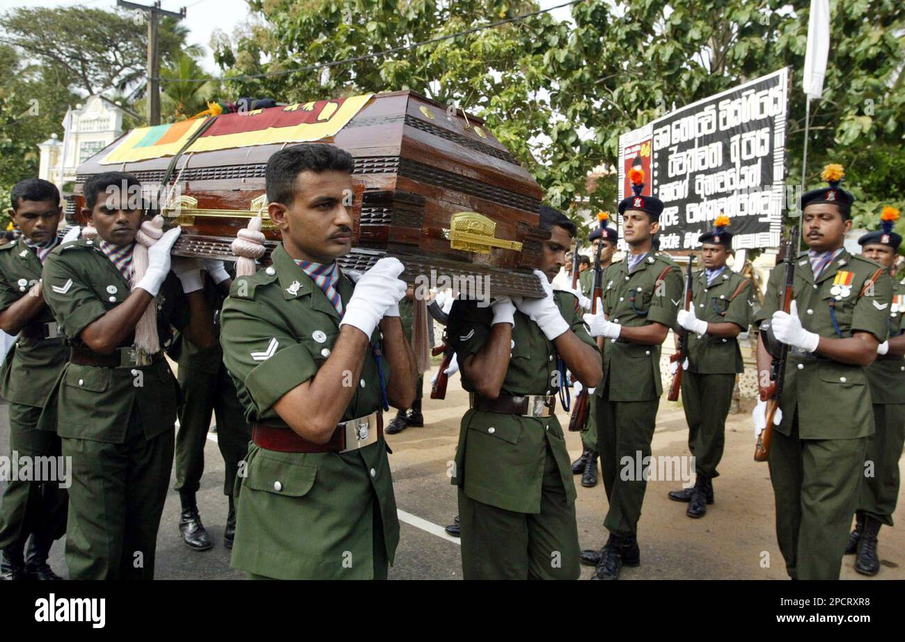 Sri Lankan army soldiers carry the coffin of Cpl. Neil Sagara ...
