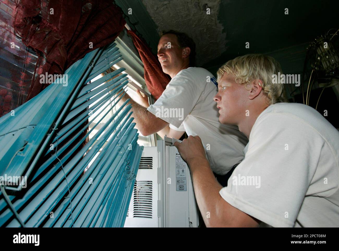Ben Keech, left, and Patrick Stueve, volunteers for the Bishop Sullivan ...