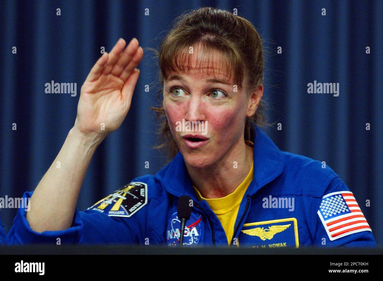 STS-121 Mission Specialist Lisa Nowak talks with reporters following ...