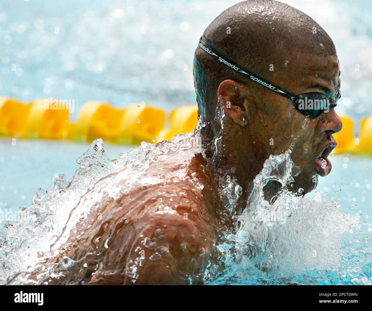 Dominic Lee of Jamaica competes in a 100 meter breastroke heat durinig ...