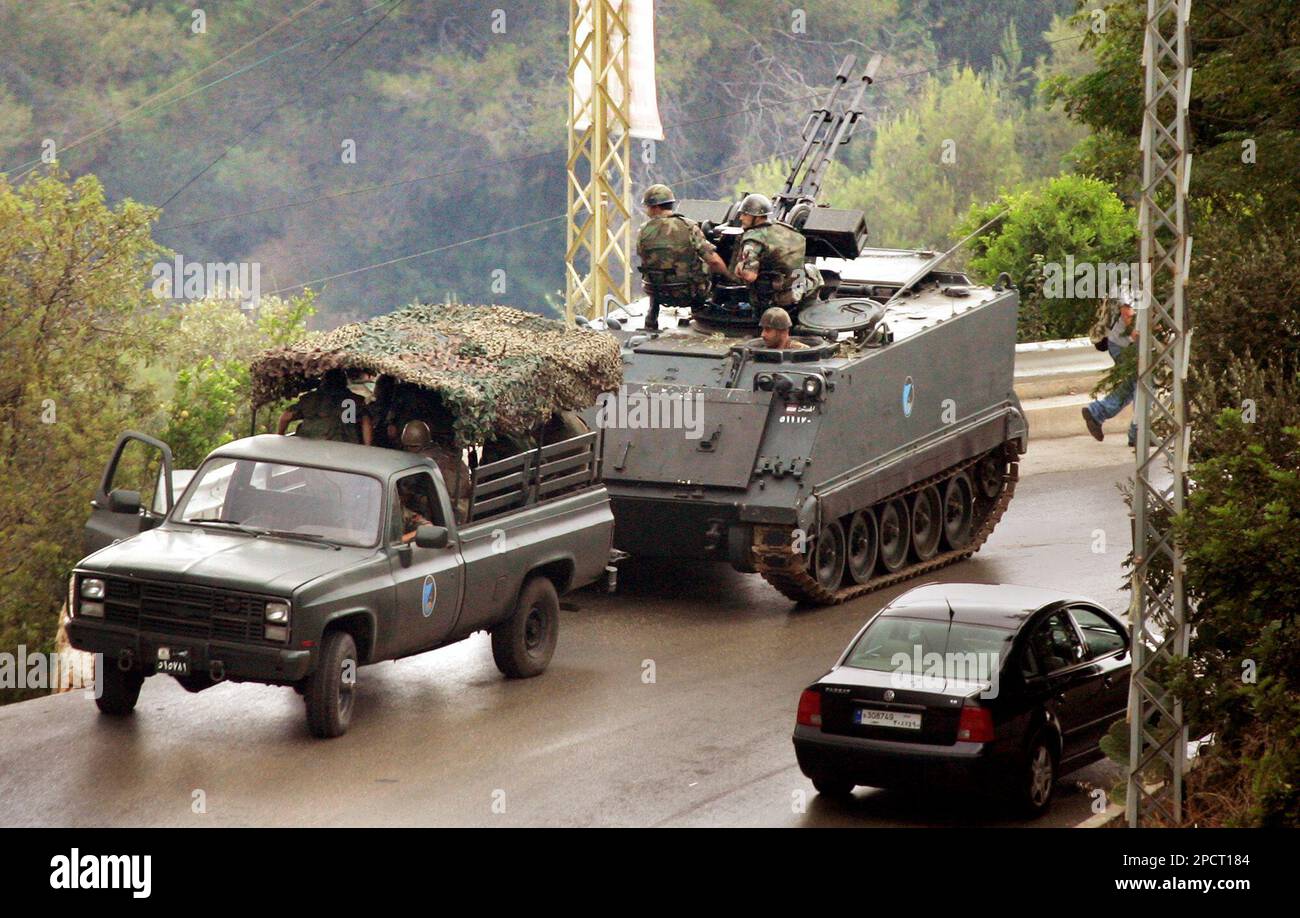 Lebanese army soldiers man an anti-aircraft gun on an armoured ...