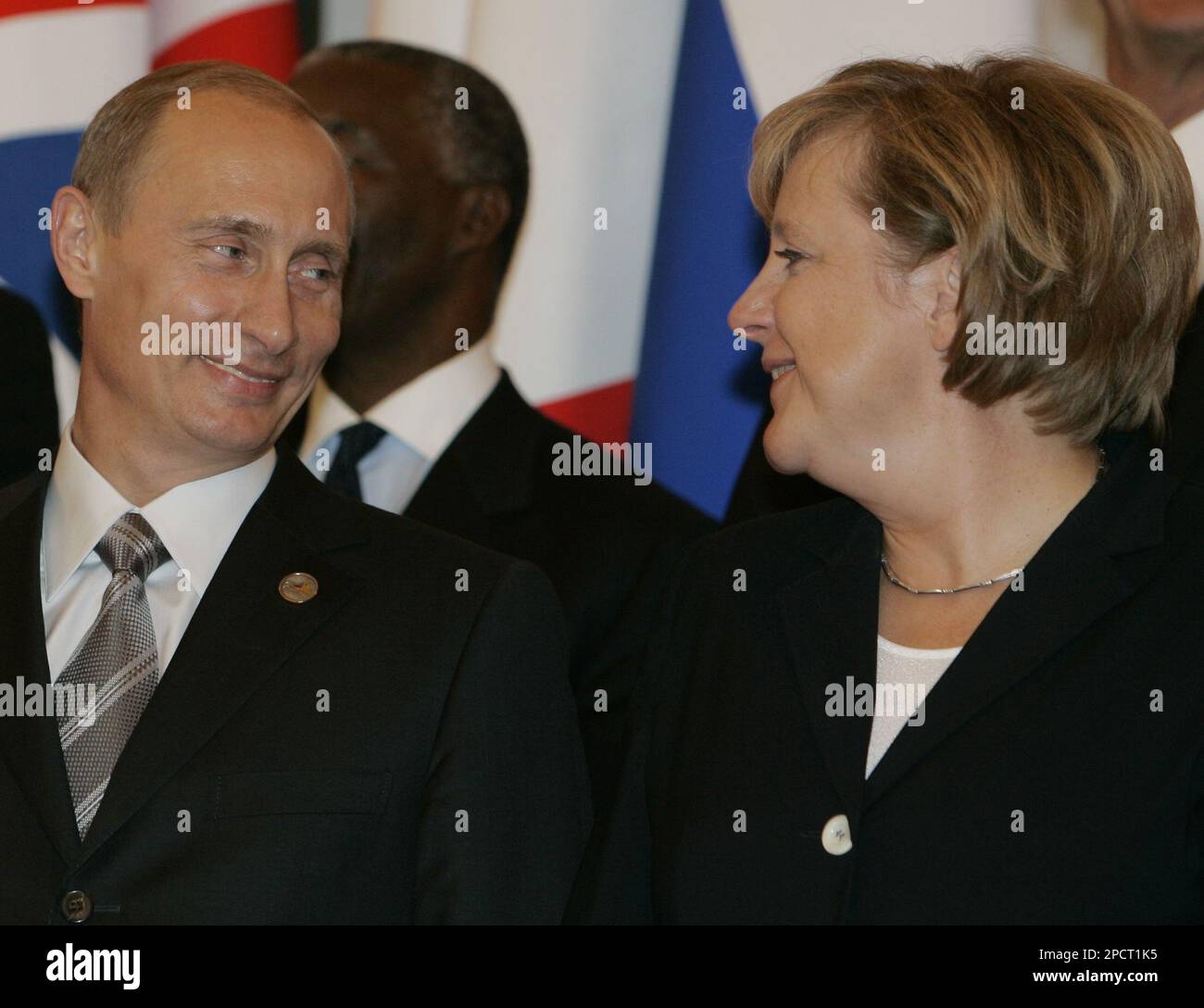 Russian President Vladimir Putin, left, and German Chancellor Angela ...