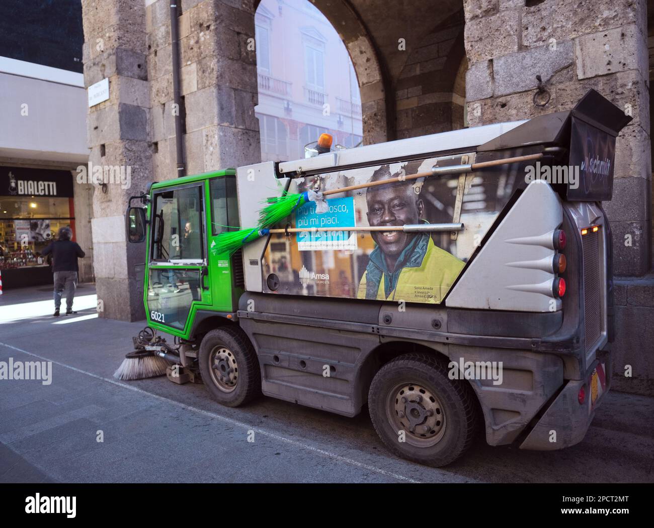 Cleaning and sanitizing the city center with a street sweeper.Milan ...