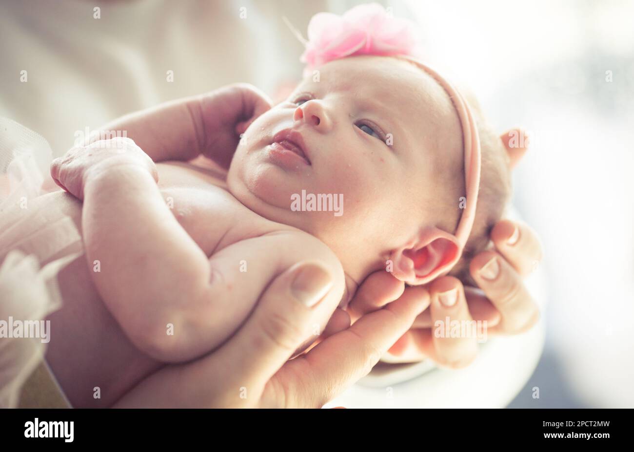 Close-up of a beautiful newborn baby girl being held by her parents Stock Photo - Alamy