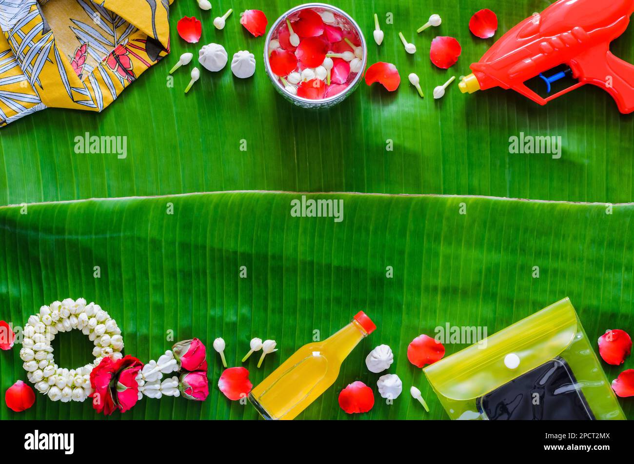 Thailand songkran festival background with water gun, shirt, garland ...