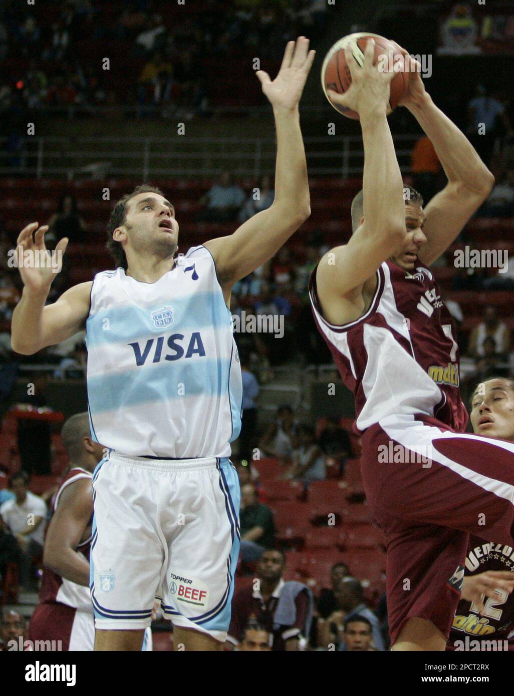 Venezuela's Richard Lugo (7) grabs a rebound against Argentina's o ...