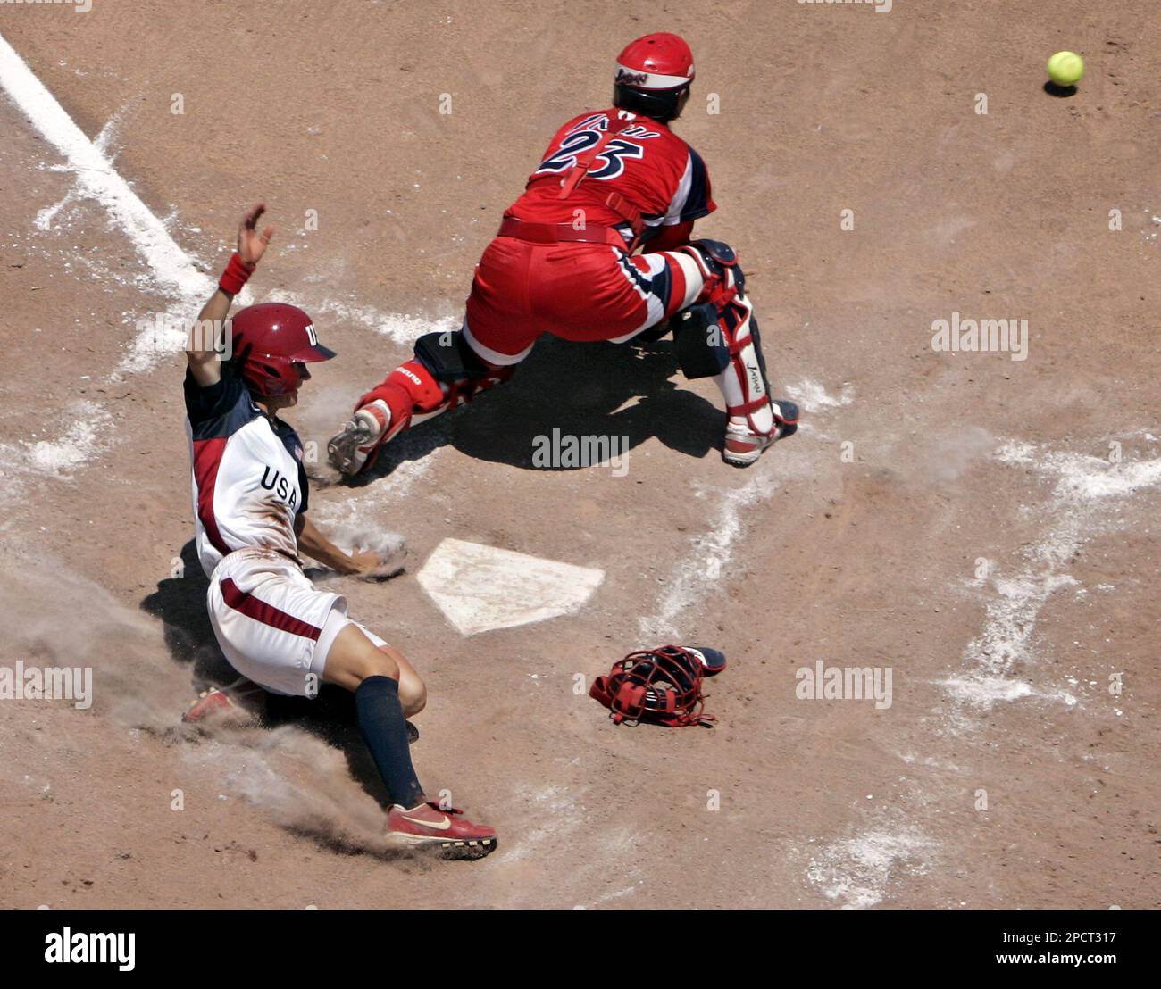 USA's Laura Berg slides home safely in the fifth inning of a World Cup ...