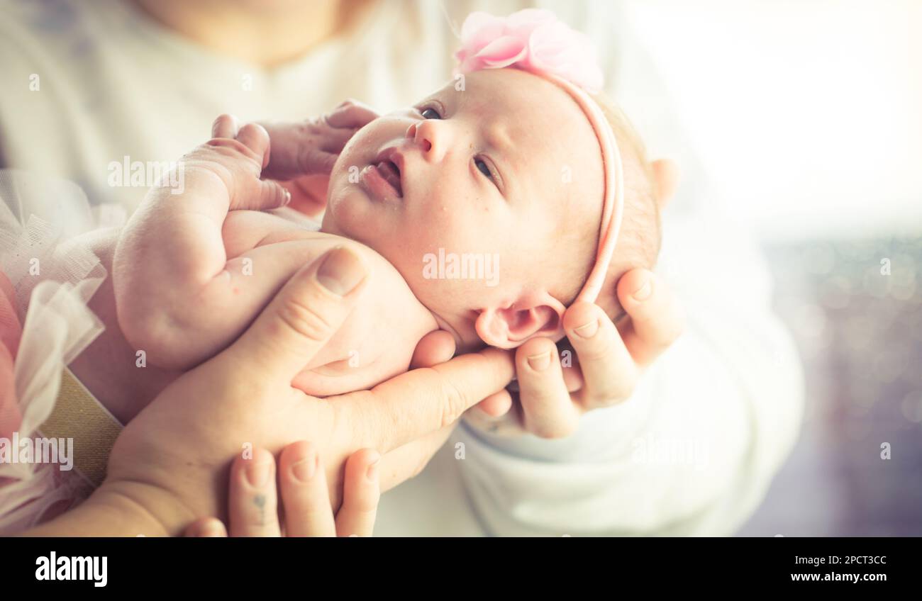 New born baby girl being held hi-res stock photography and images - Alamy
