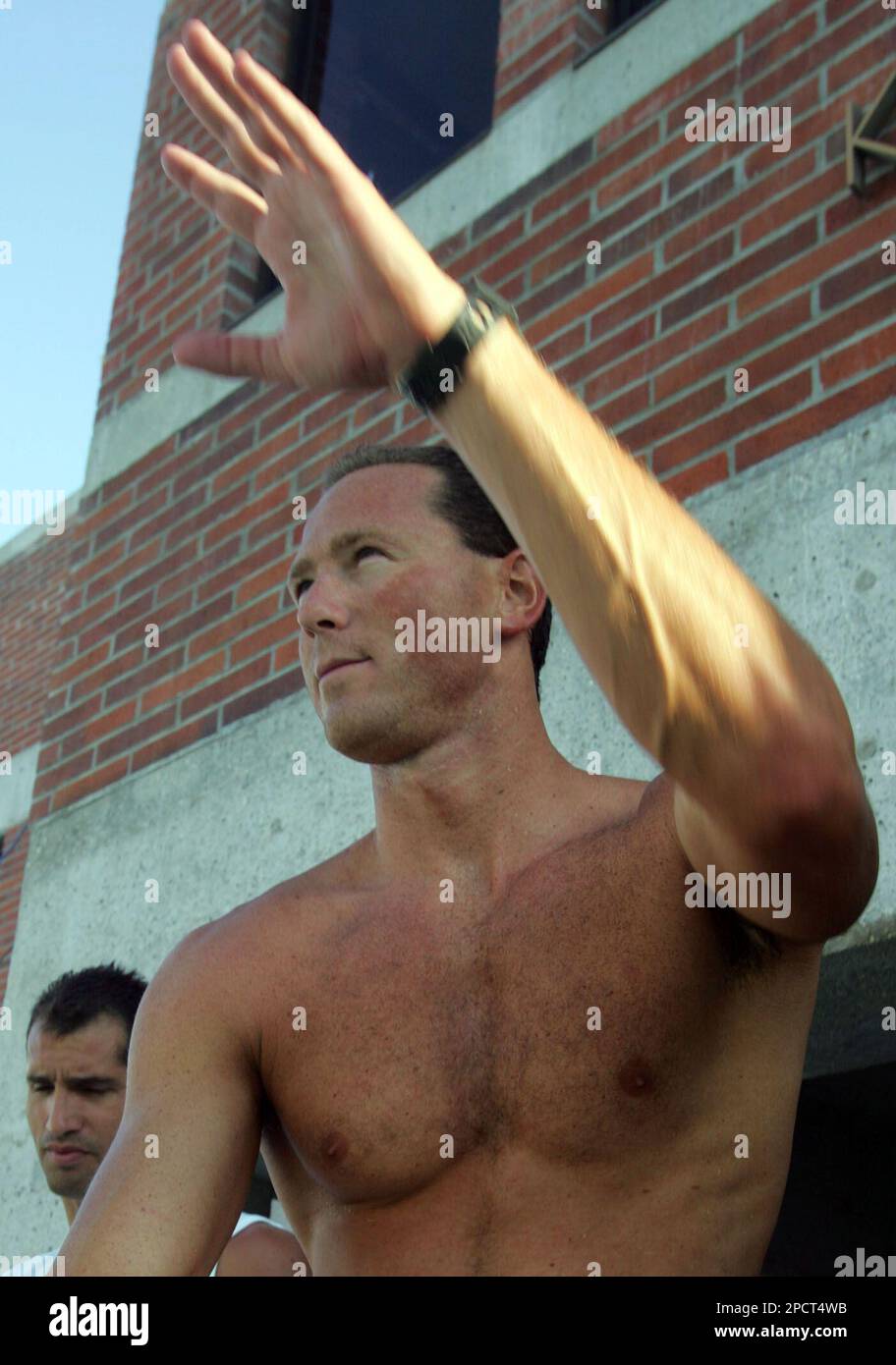 Jason Lezak waves after winning the men's 50-meter freestyle at the ...