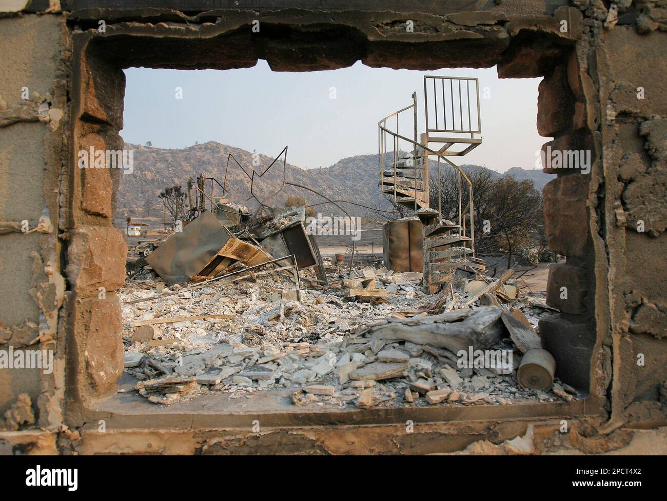 The remains of a house burned down during the Sawtooth Complex fire is ...