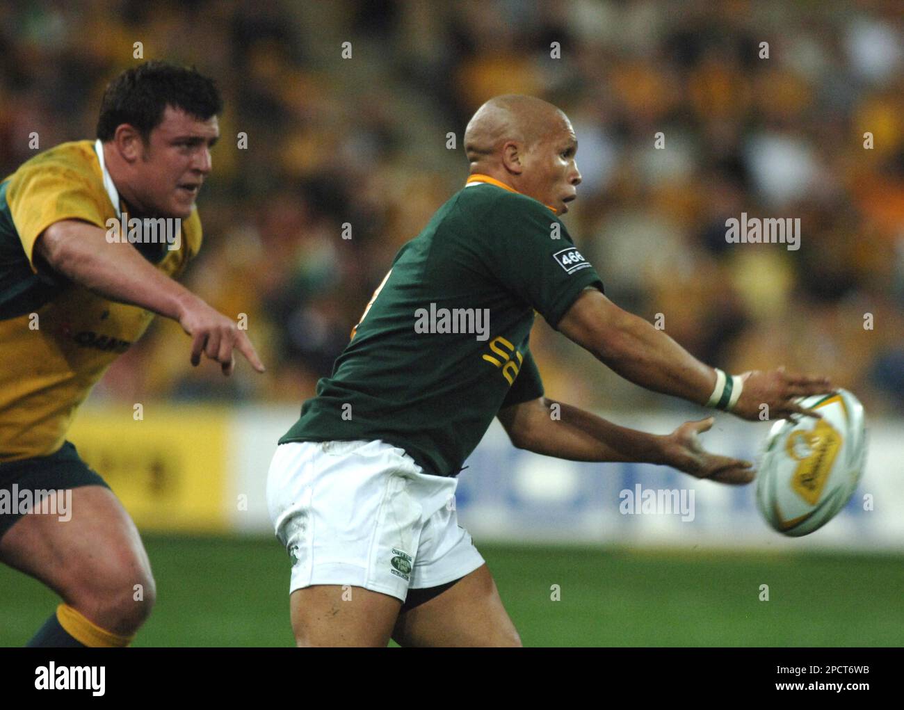 Australia's Guy Shepherdson, left, chases South Africa's Ricky Januarie ...