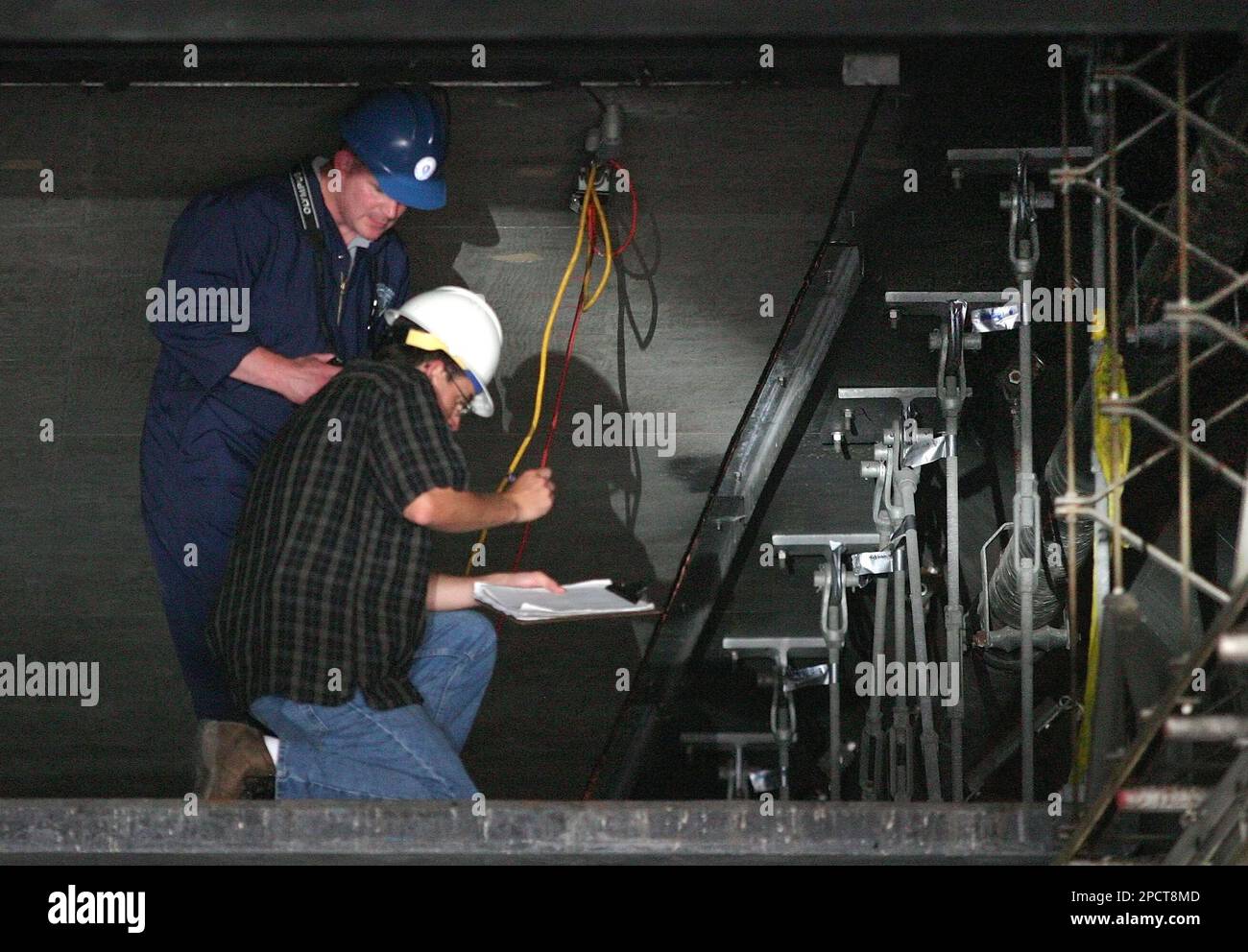 A Massachusetts State Police crime scene services worker, left rear ...