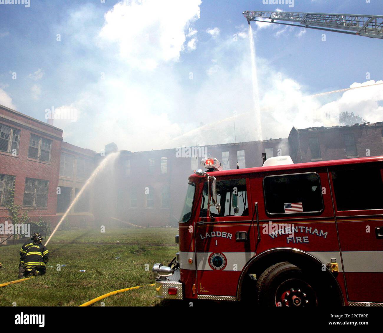 Firefighters battle a fire at the old Foxborough State Hospital in ...